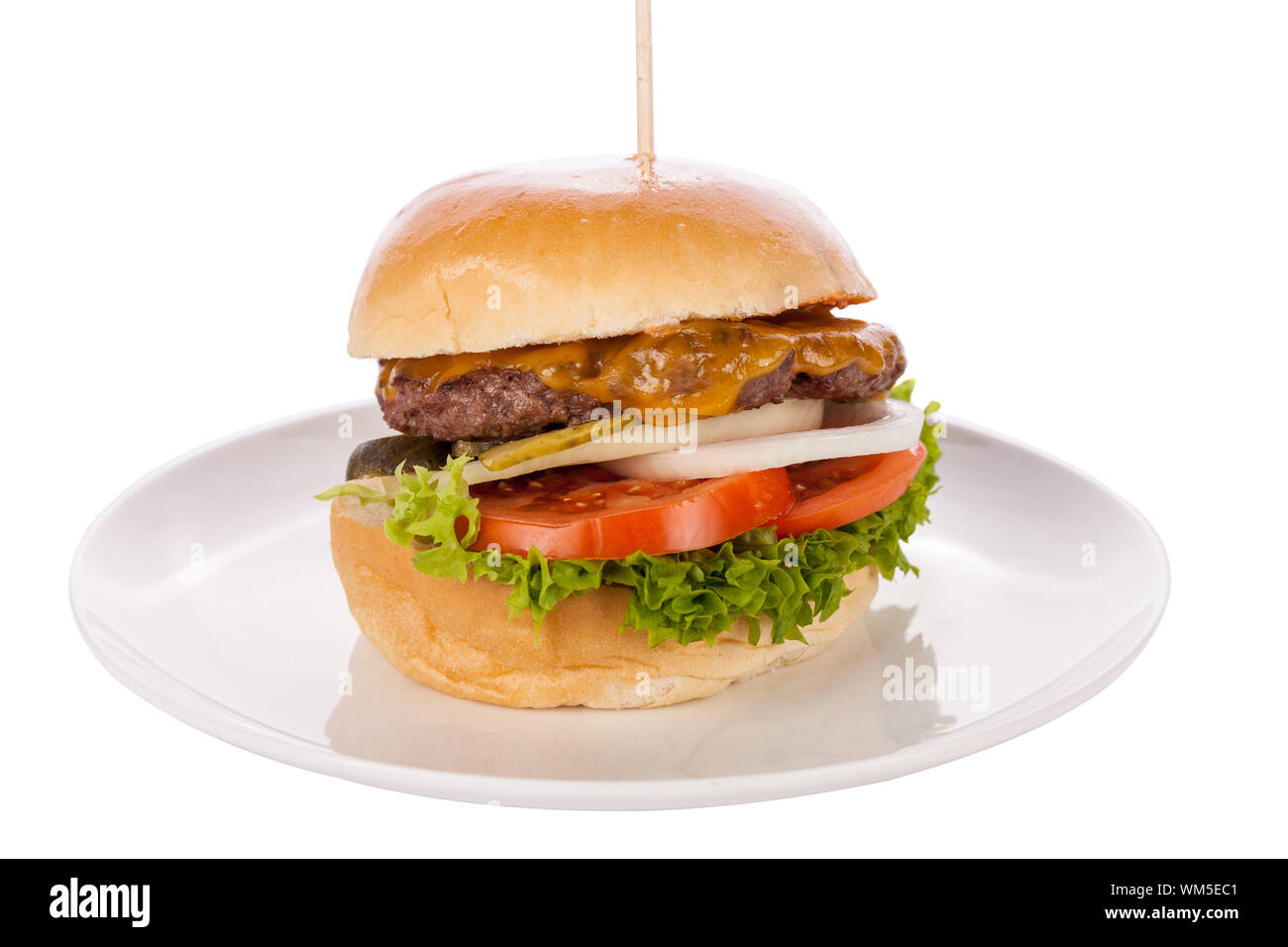Tasty traditional cheeseburger with a ground beef patty topped with ...