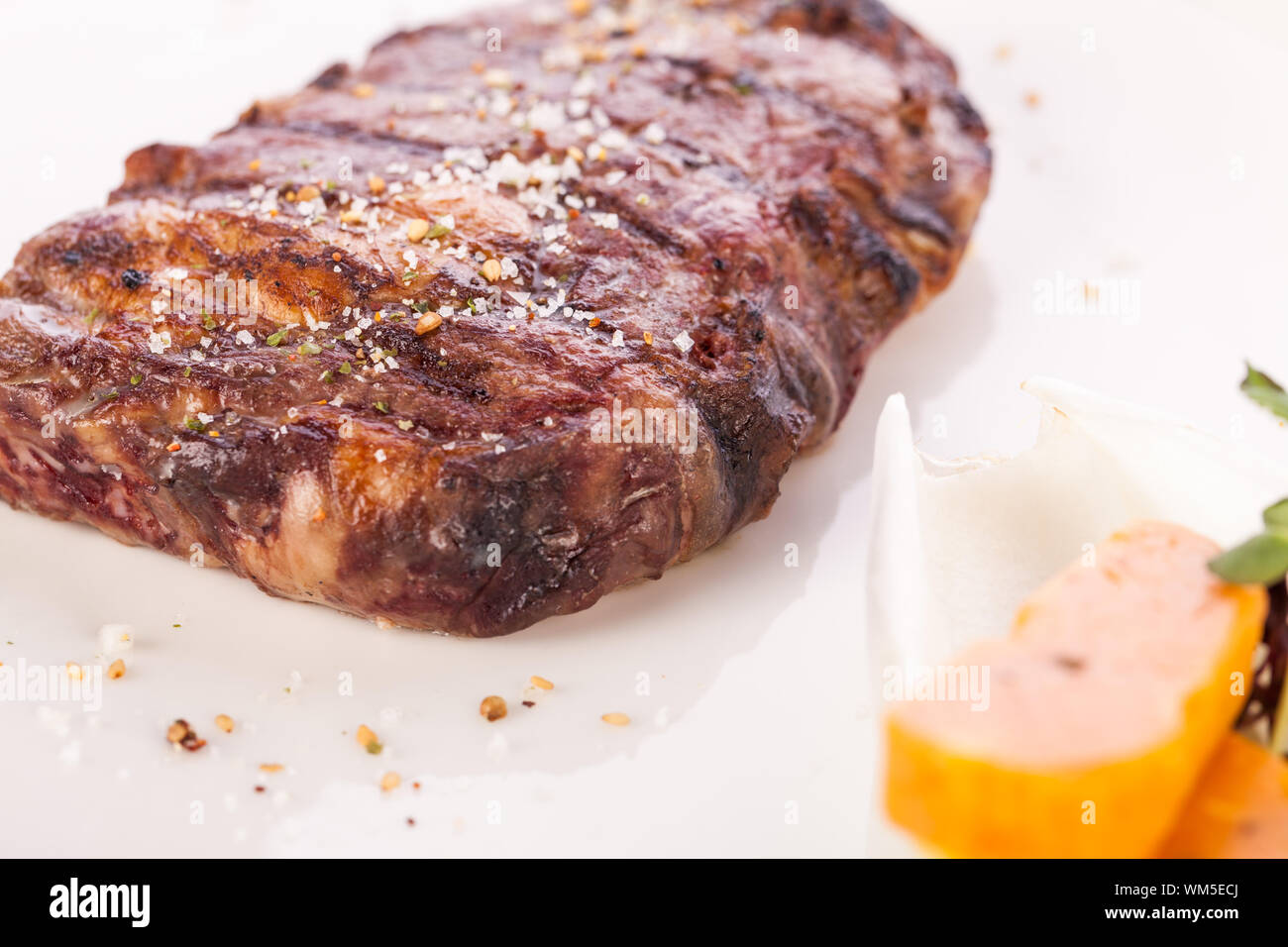 Grilled beef steak with seasoning Stock Photo - Alamy