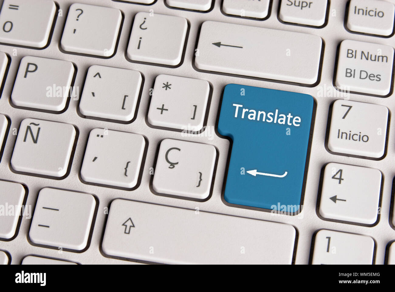 Spanish keyboard with language translate concept icon over blue ...