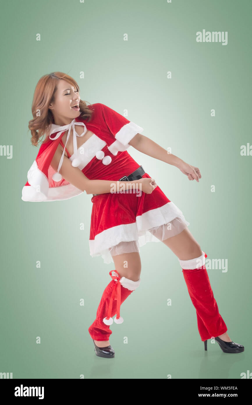 Christmas girl pull something, full length portrait Stock Photo - Alamy