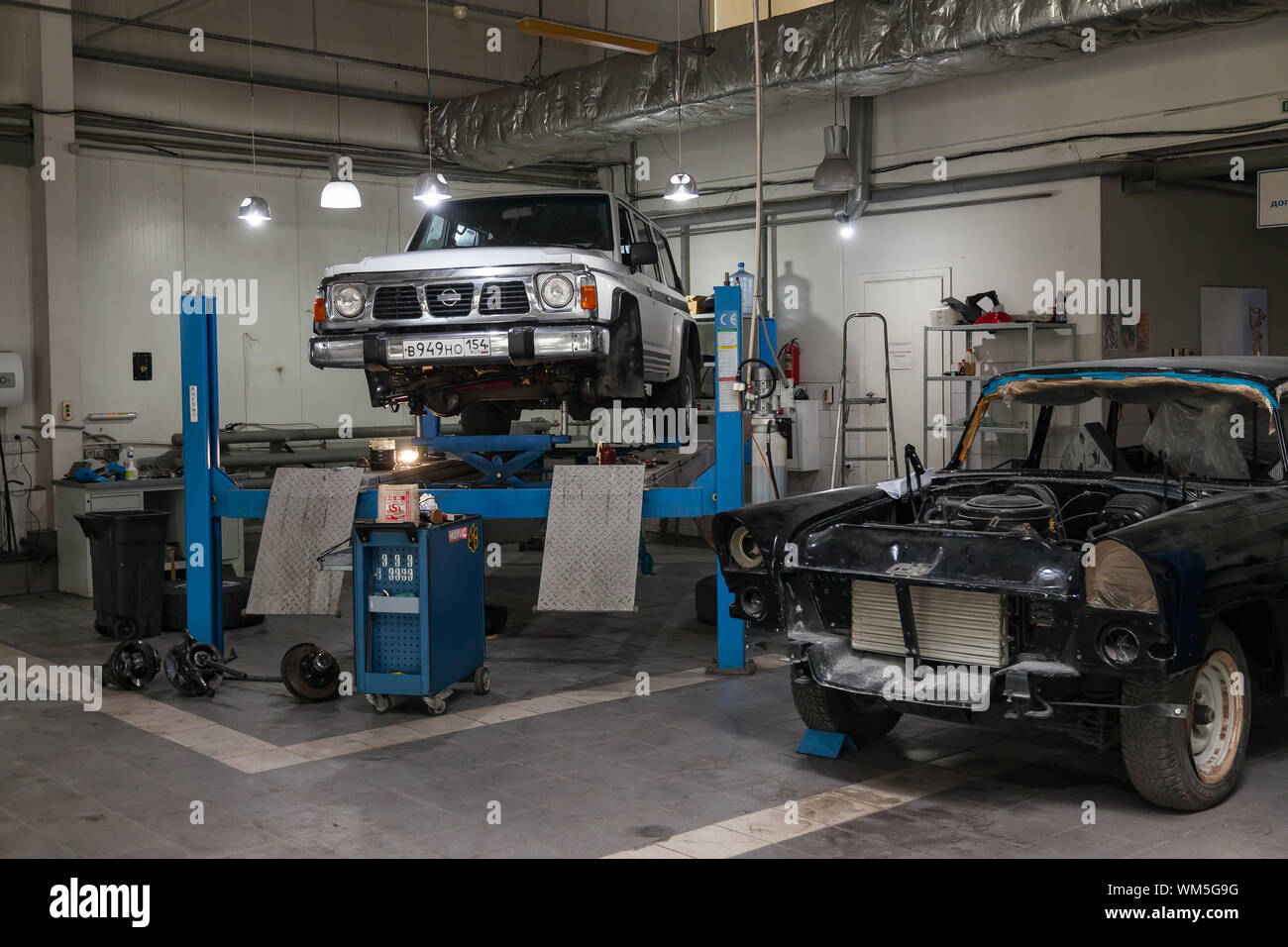 Novosibirsk, Russia - 08.01.2018: White used car Nissan Patrol raised ...