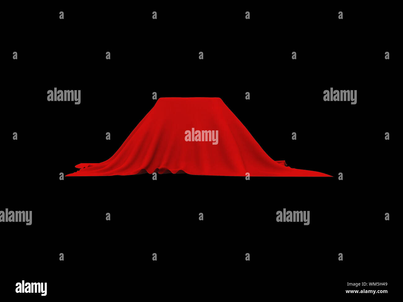 Object of rectangular shape covered with thick red cloth. Side view ...