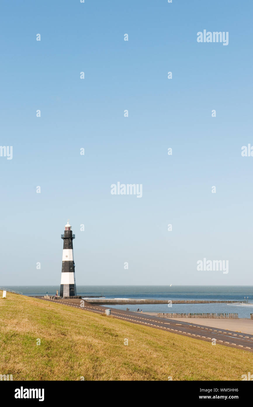 Sea landscape with lighthouse at the beach Stock Photo - Alamy
