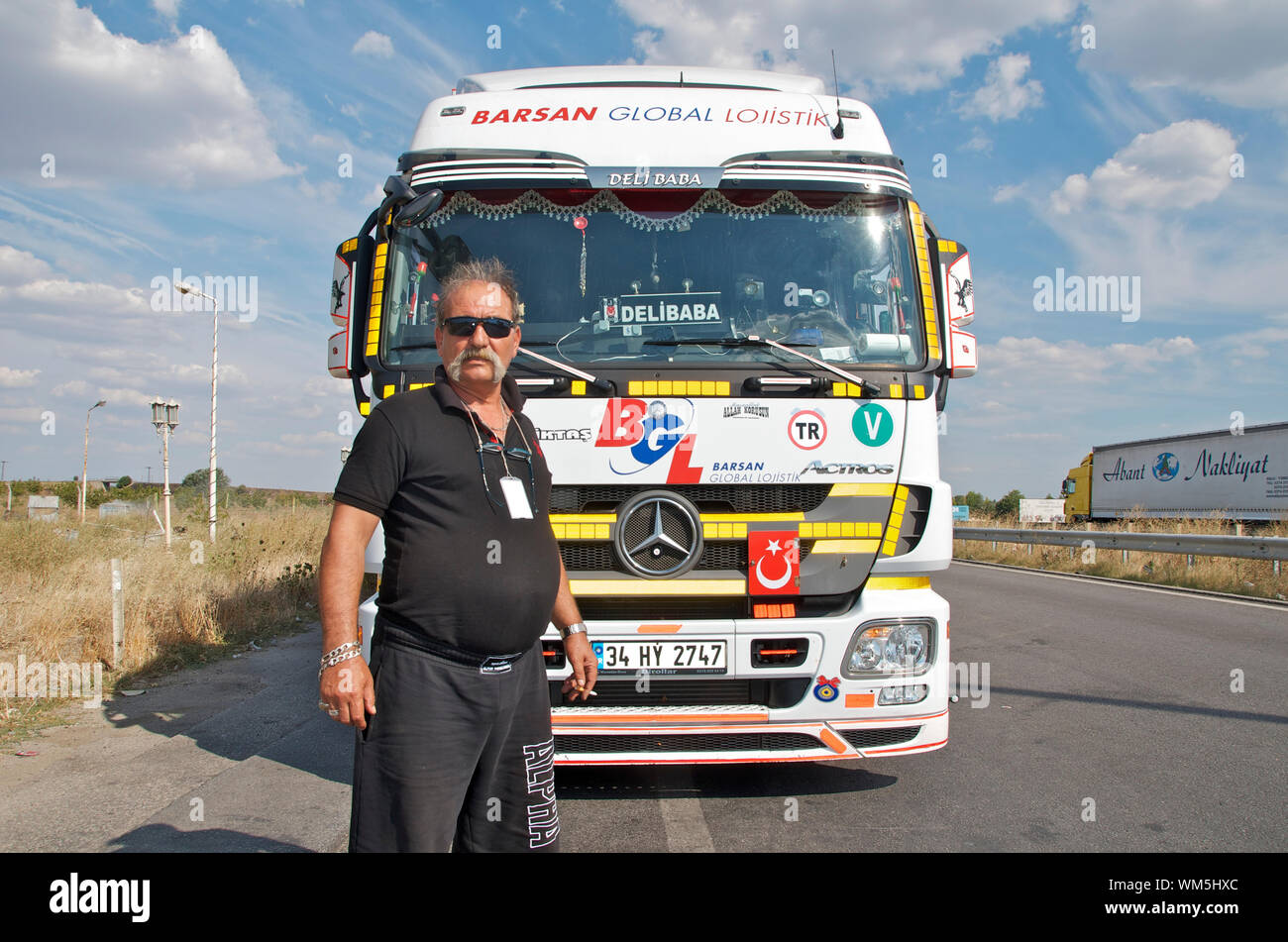 Turkish truck driver poses proudly in front of his Mercedes decorated ...