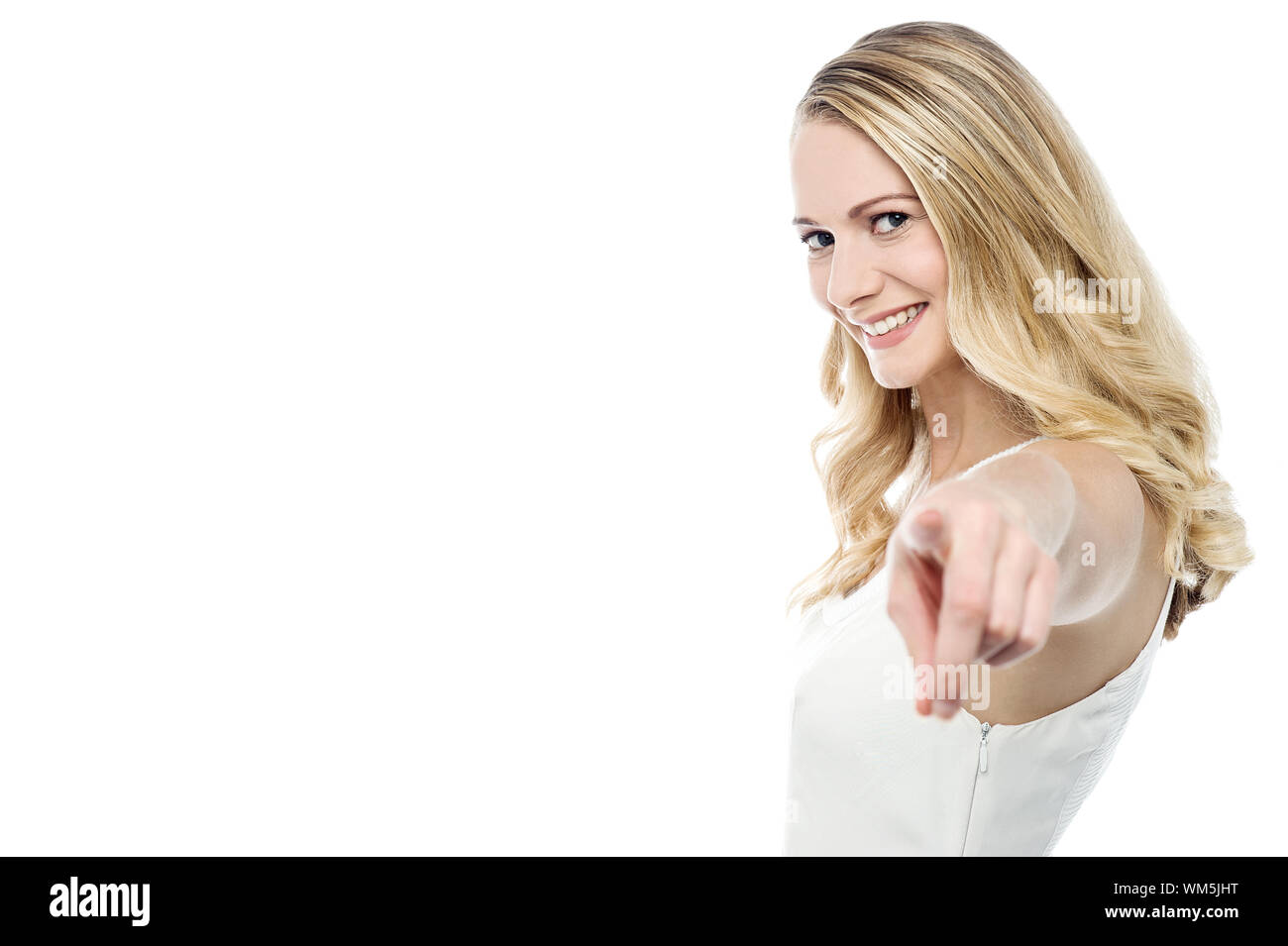 Trendy woman pointing towards camera Stock Photo - Alamy