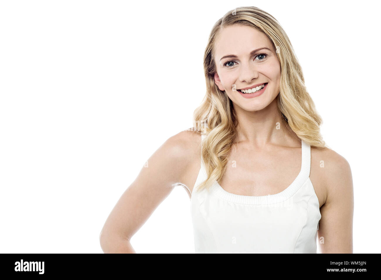 Beautiful woman posing with welcoming smile Stock Photo - Alamy