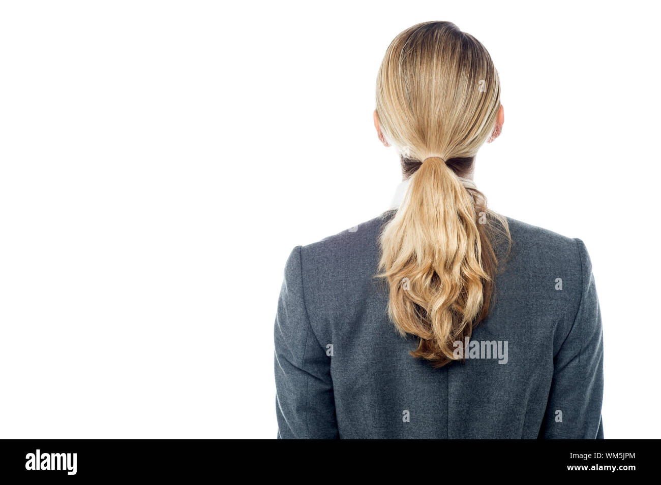 Back view of business woman, facing the wall Stock Photo - Alamy