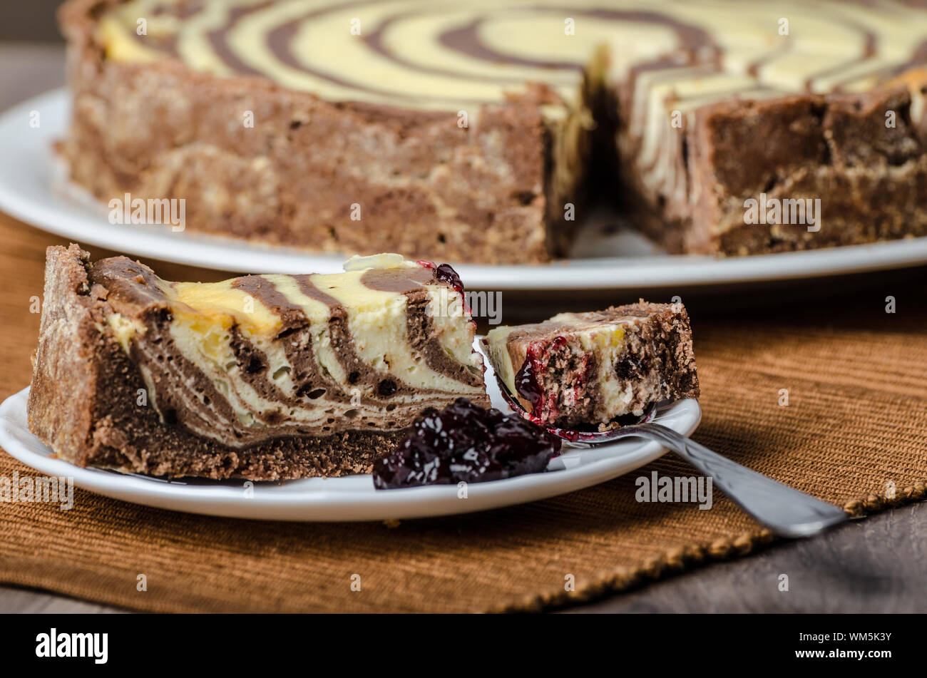 Two-tone cheesecake with homemade cherry jam, homamade Stock Photo - Alamy