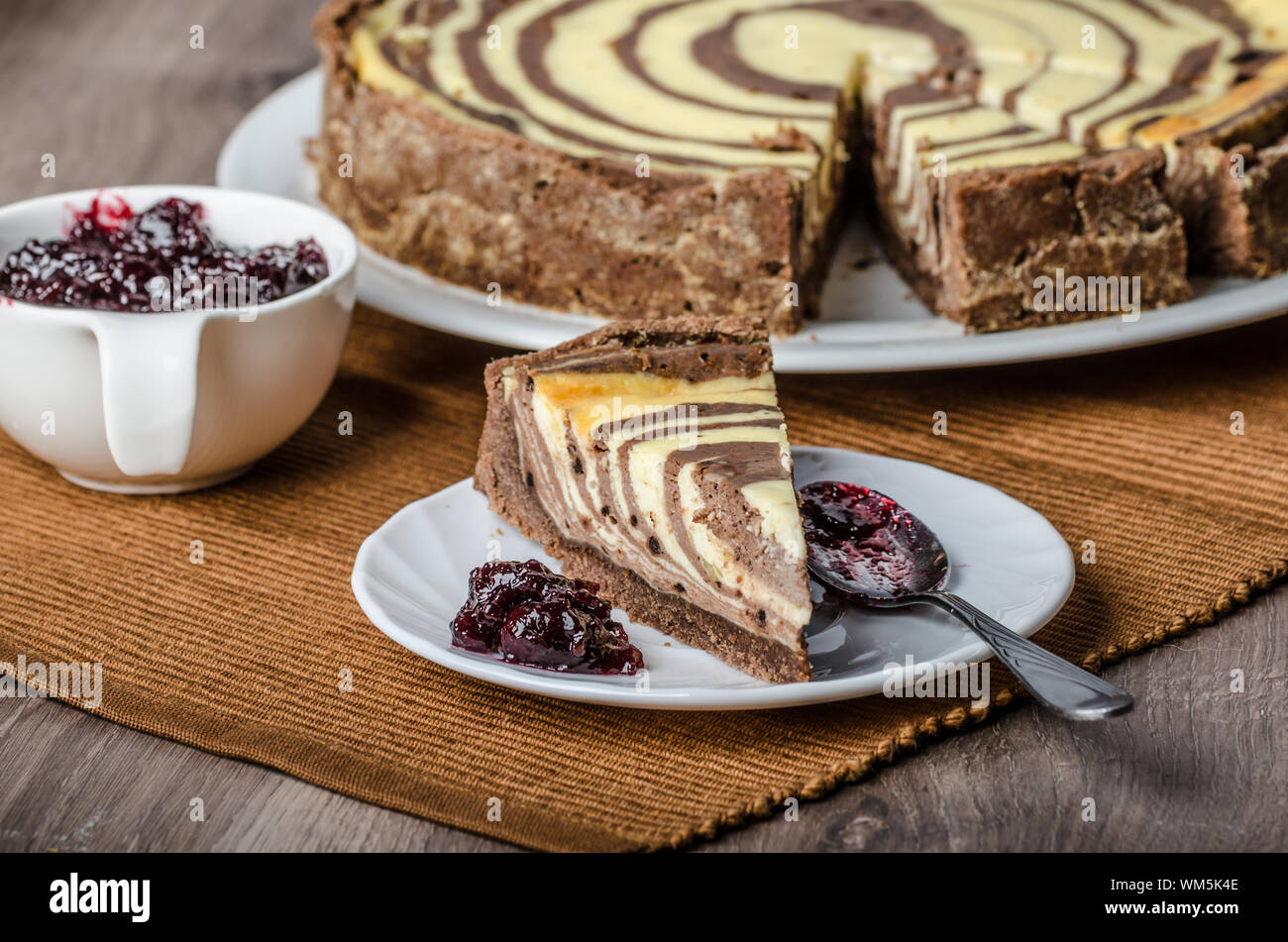 Two-tone cheesecake with homemade cherry jam, homamade Stock Photo - Alamy