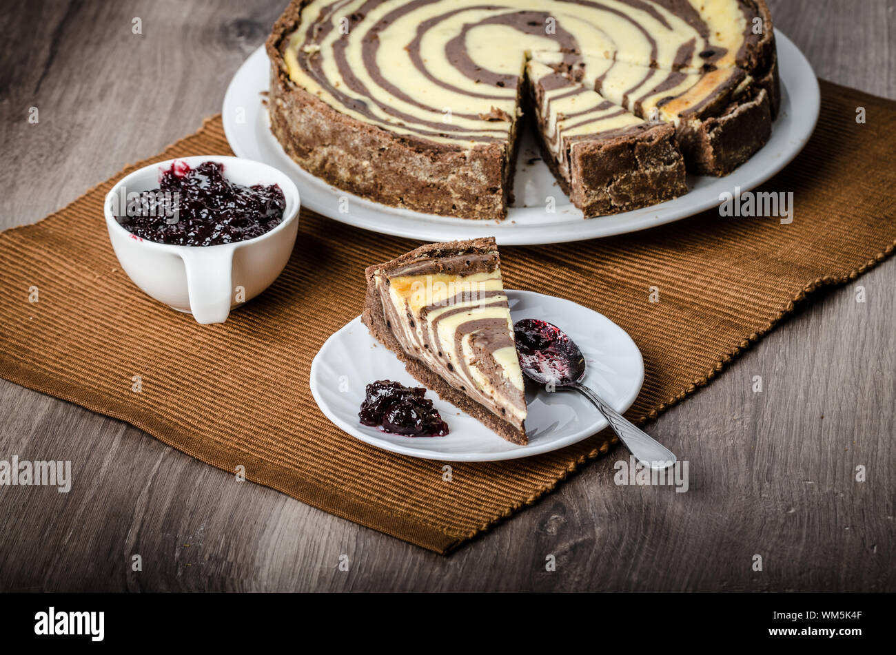 Two-tone cheesecake with homemade cherry jam, homamade Stock Photo - Alamy