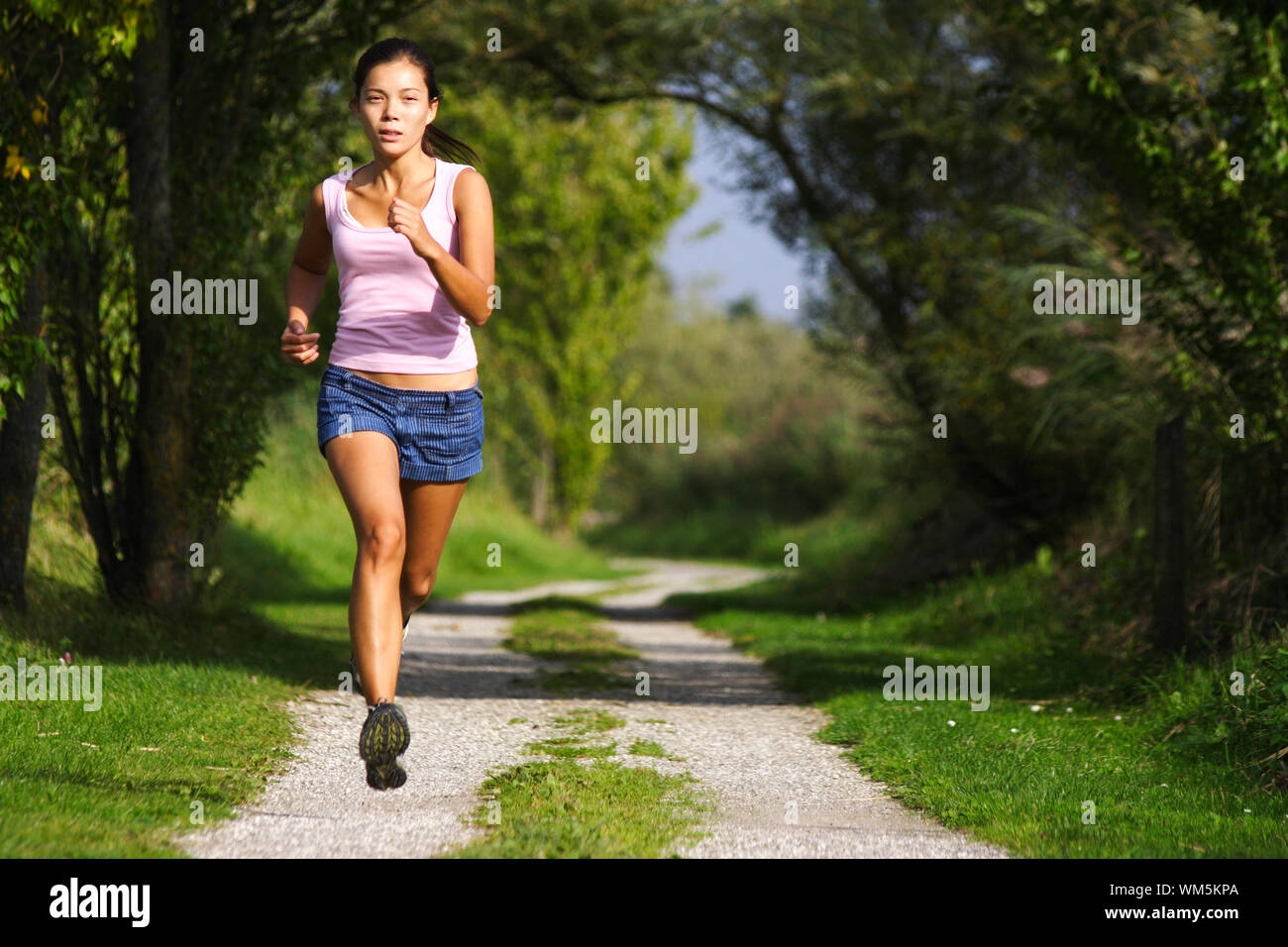 Running. Woman running at great speed. Freeze action image on beautiful ...
