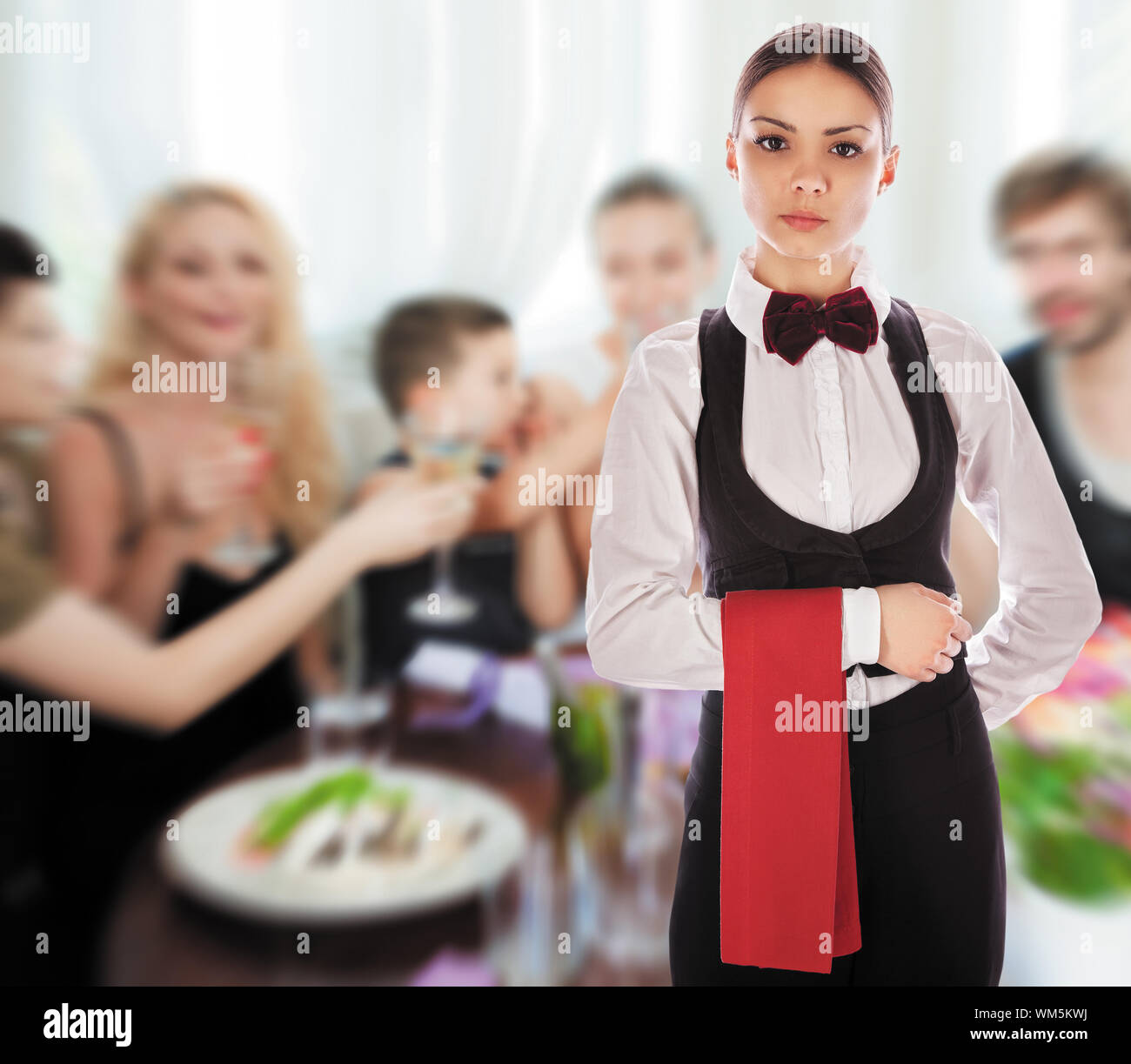 Waitress with a red cloth and tie in restaurant. Isolated with work ...
