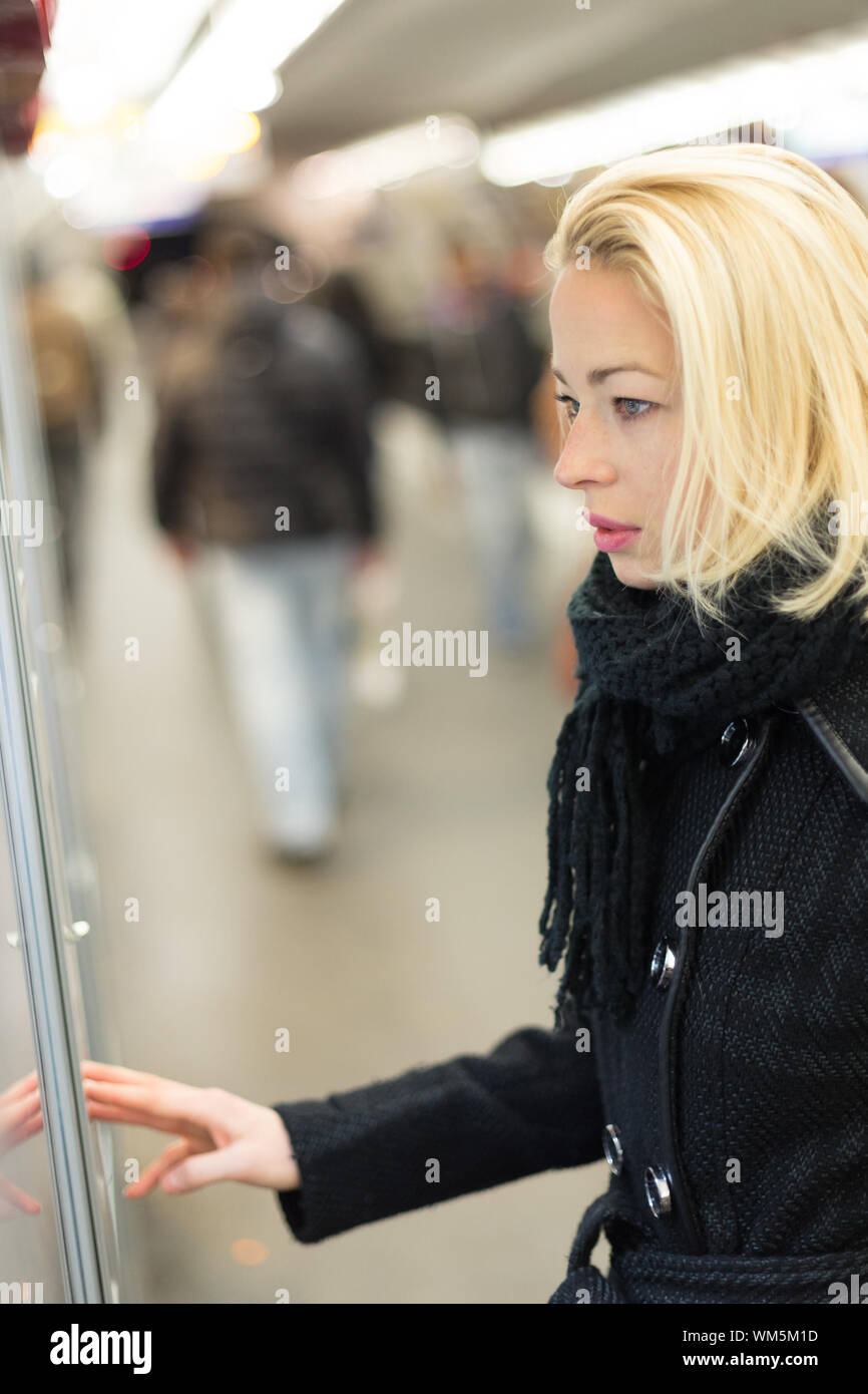 Lady buying ticket for public transport Stock Photo - Alamy