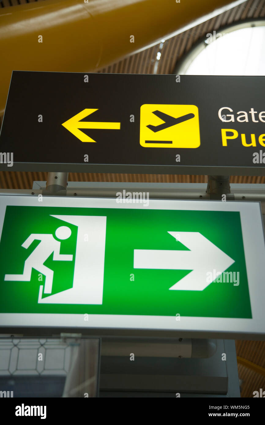 emergency exit and departure fly gate signals inside airport hall Stock ...