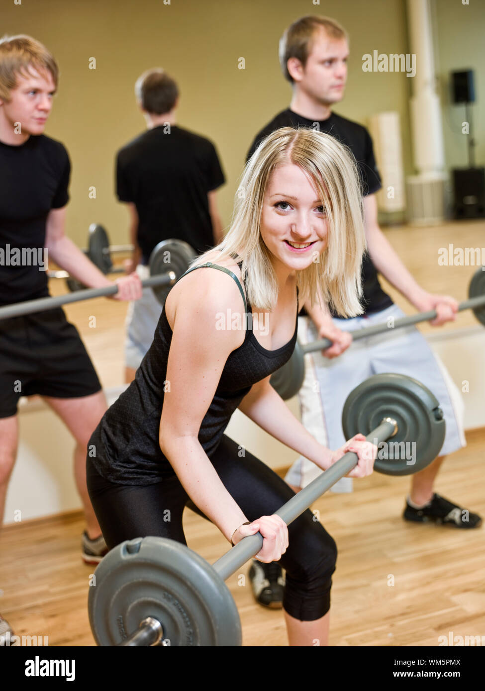 Girl lifting weights at the gym Stock Photo - Alamy