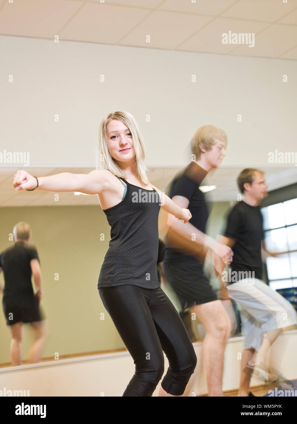 Group of people doing step up with a girl in focus Stock Photo - Alamy