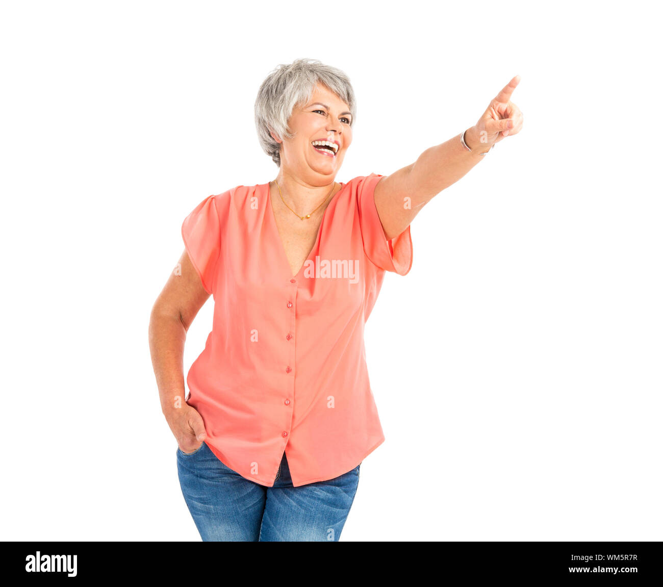 Happy old woman pointing to something Stock Photo - Alamy