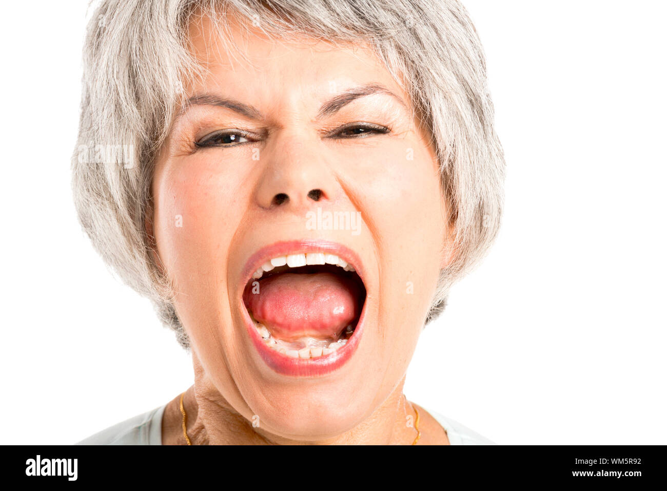 Portrait of a elderly woman with a yelling expression Stock Photo - Alamy