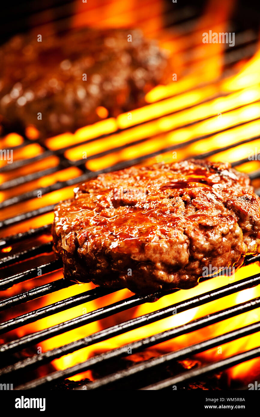 Close up photograph of two grilled beef burgers Stock Photo - Alamy
