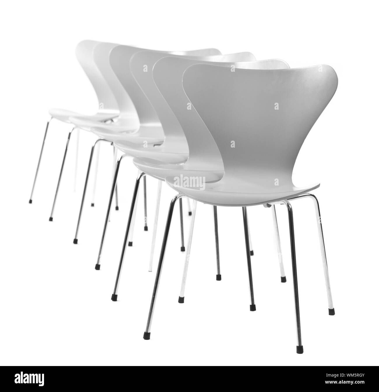 Chairs in a row isolated on a white background Stock Photo - Alamy