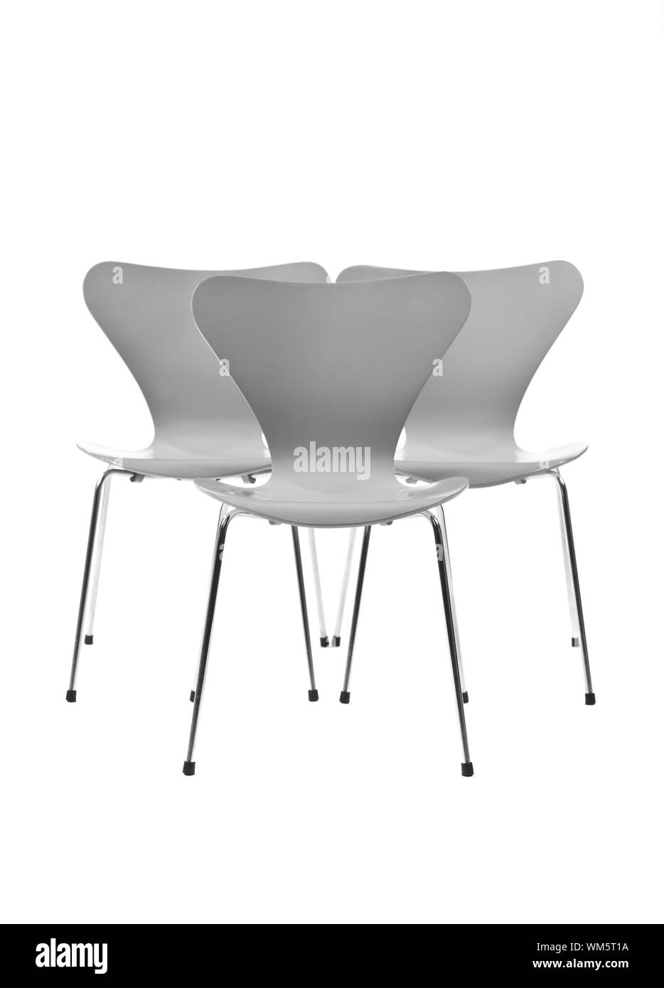Three chairs isolated on white background Stock Photo - Alamy