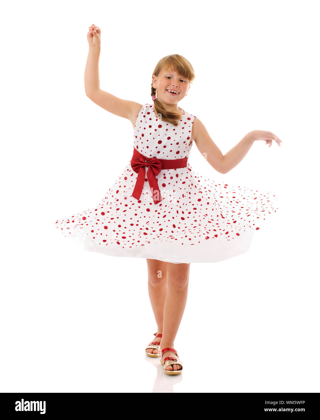 Cheerful girl spinning on floor isolated on white Stock Photo - Alamy