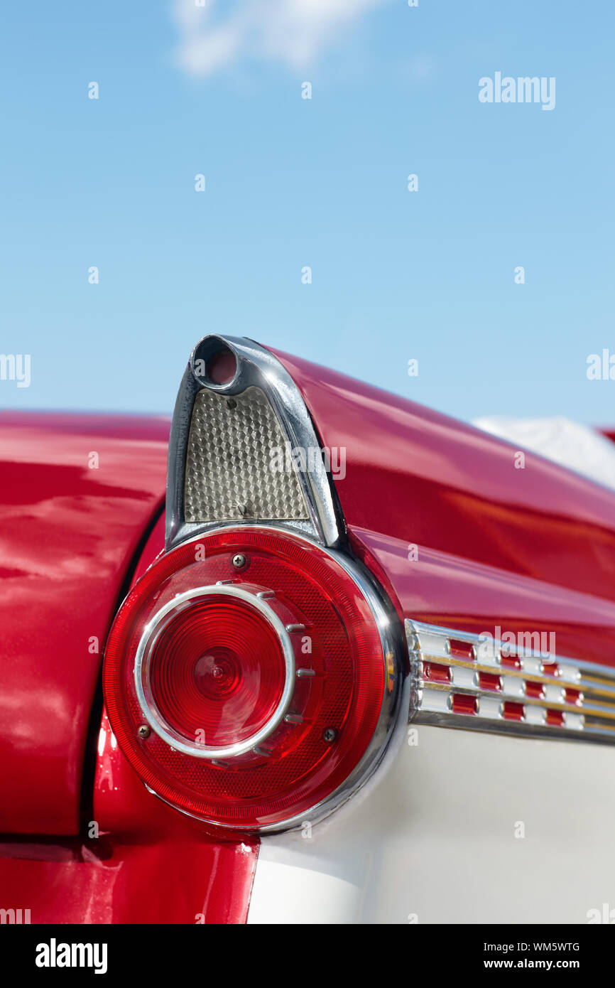 close up of 1960s red convertible car in Cuba. Vertical shape, copy ...