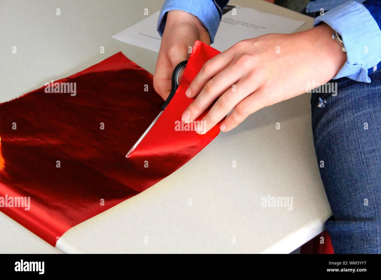 Cutting of paper hi-res stock photography and images - Alamy