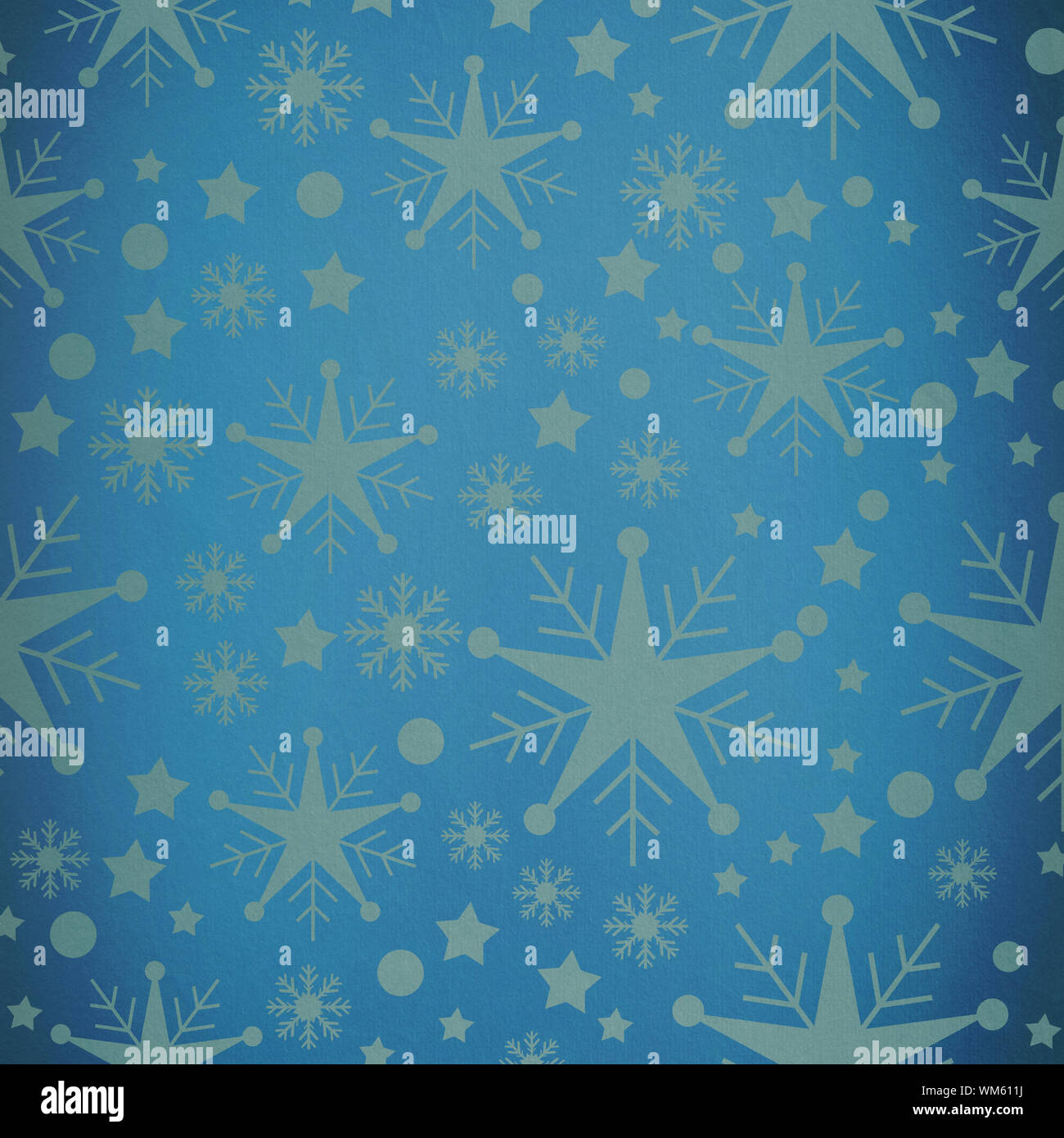Snowflake pattern against blue vignette Stock Photo - Alamy