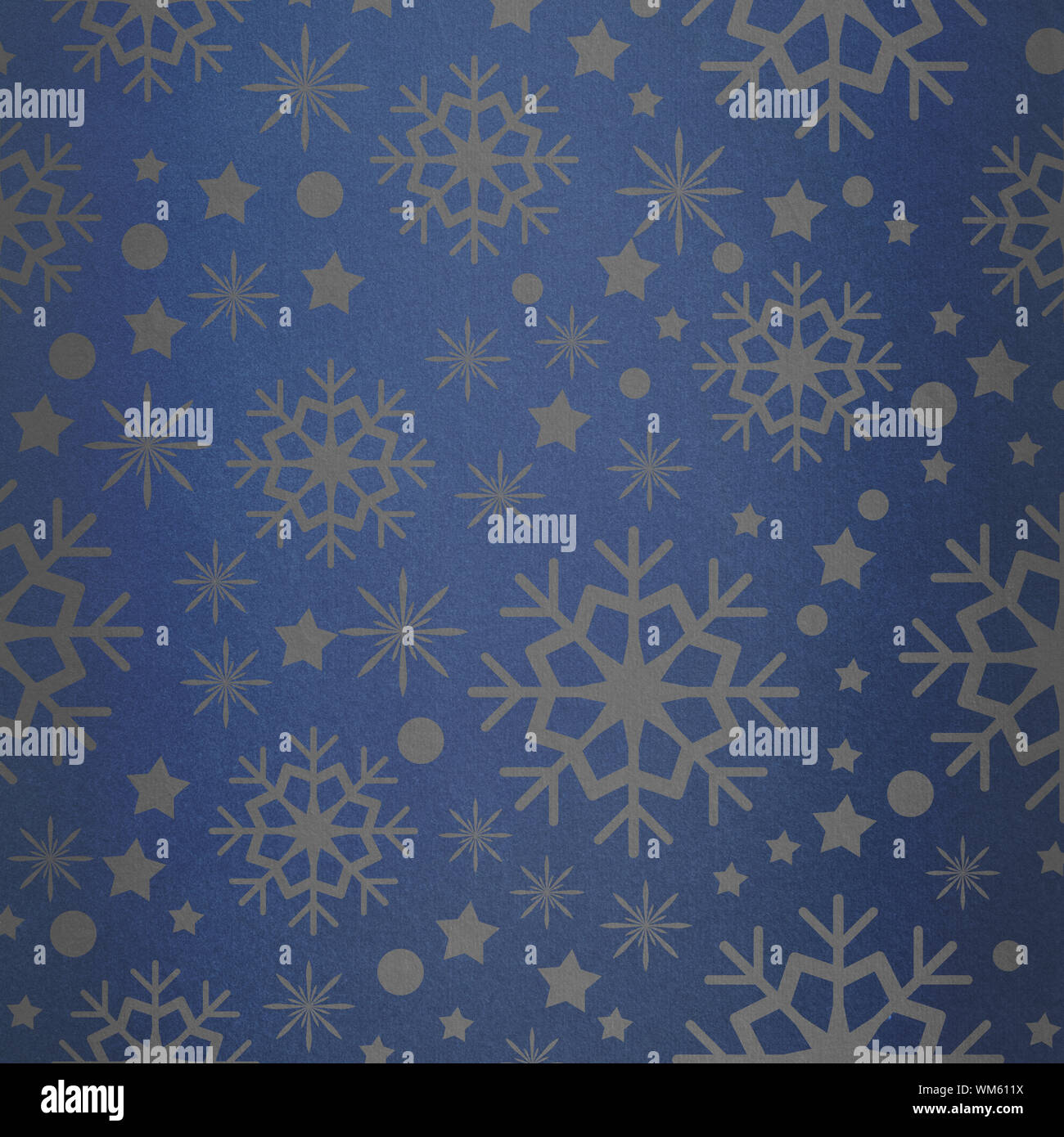 Snowflake pattern against blue vignette Stock Photo - Alamy
