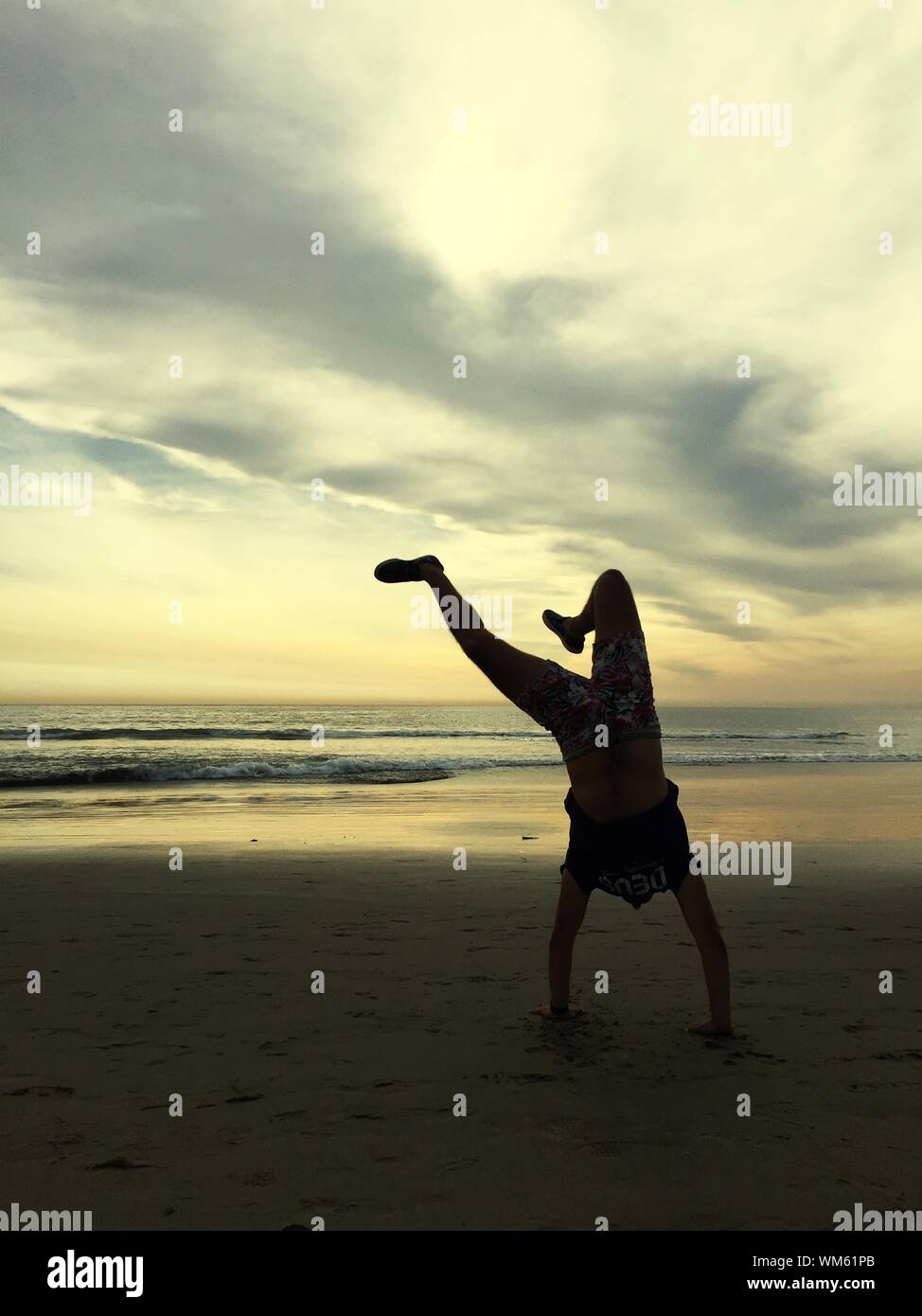 Doing handstand in sea hi-res stock photography and images - Alamy