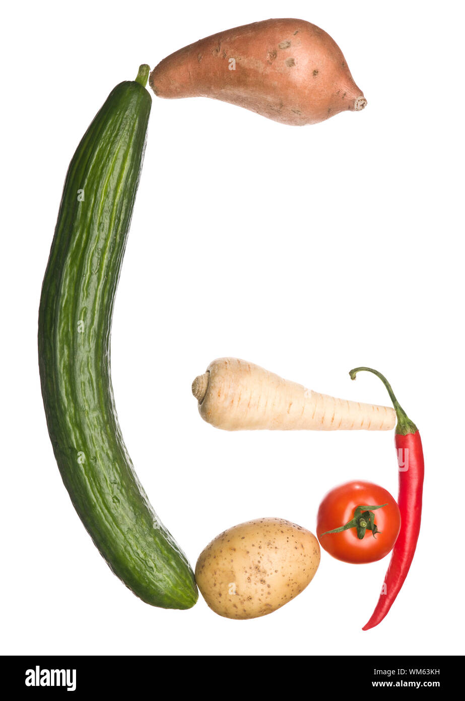 The letter 'G' made out of vegetables isolated on a white background ...