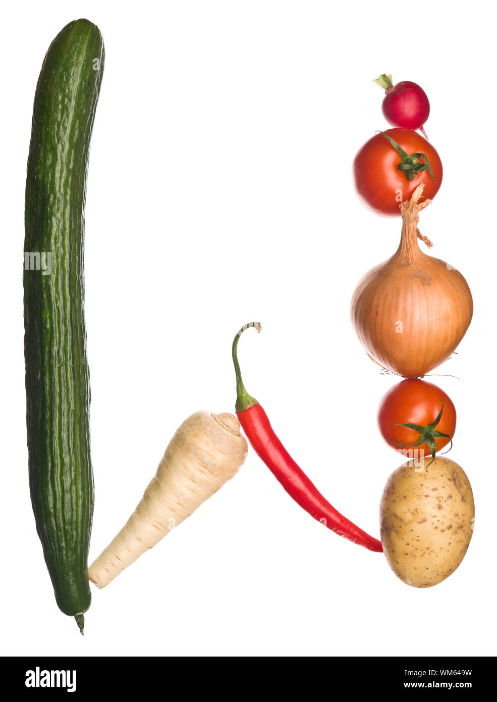 The letter 'W' made out of vegetables isolated on a white background ...