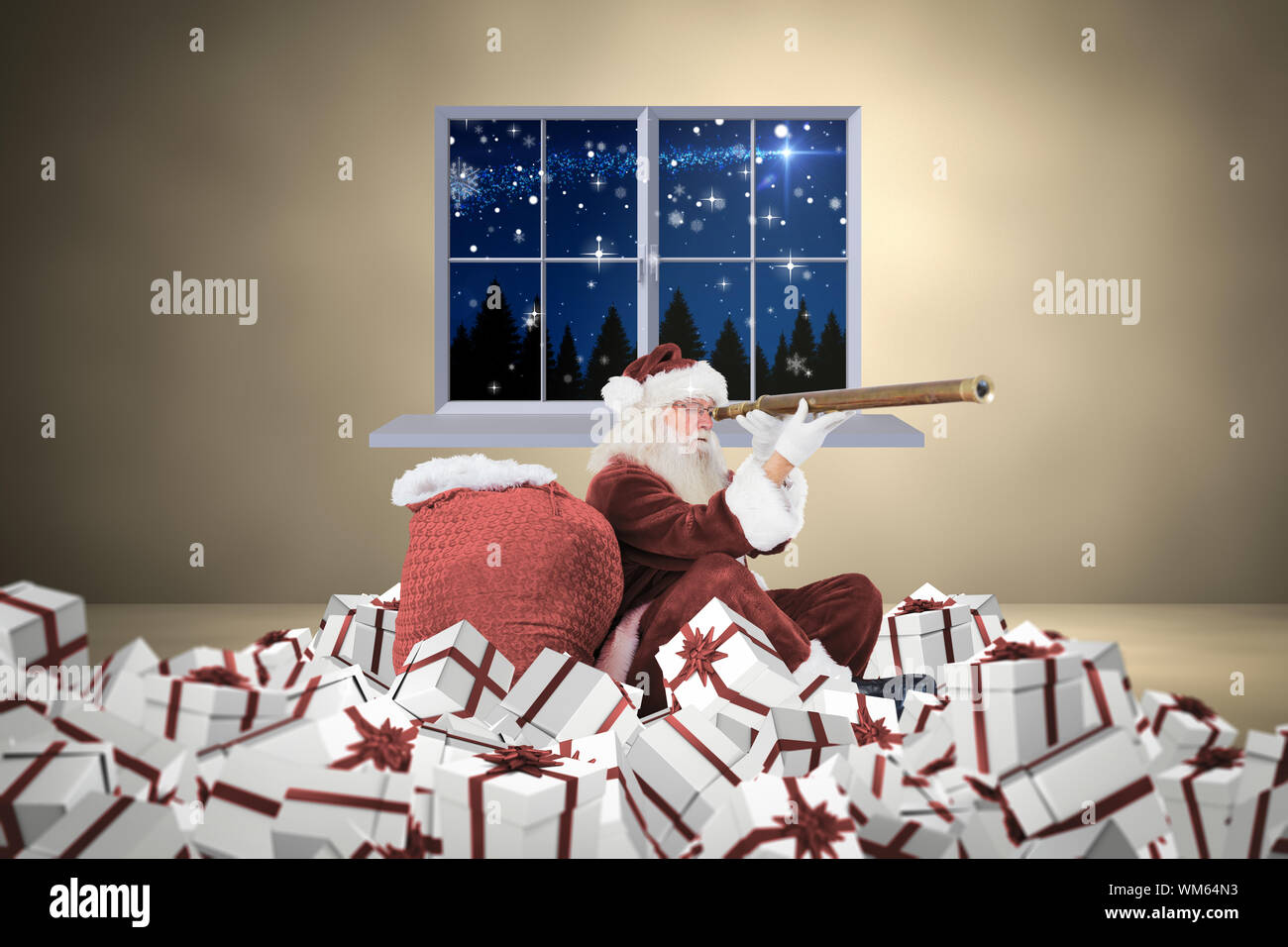 Santa looking through a telescope against grey room Stock Photo - Alamy