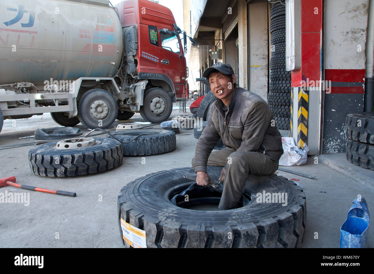 a garage for trucks in a small town of Yunnan in China Stock Photo - Alamy