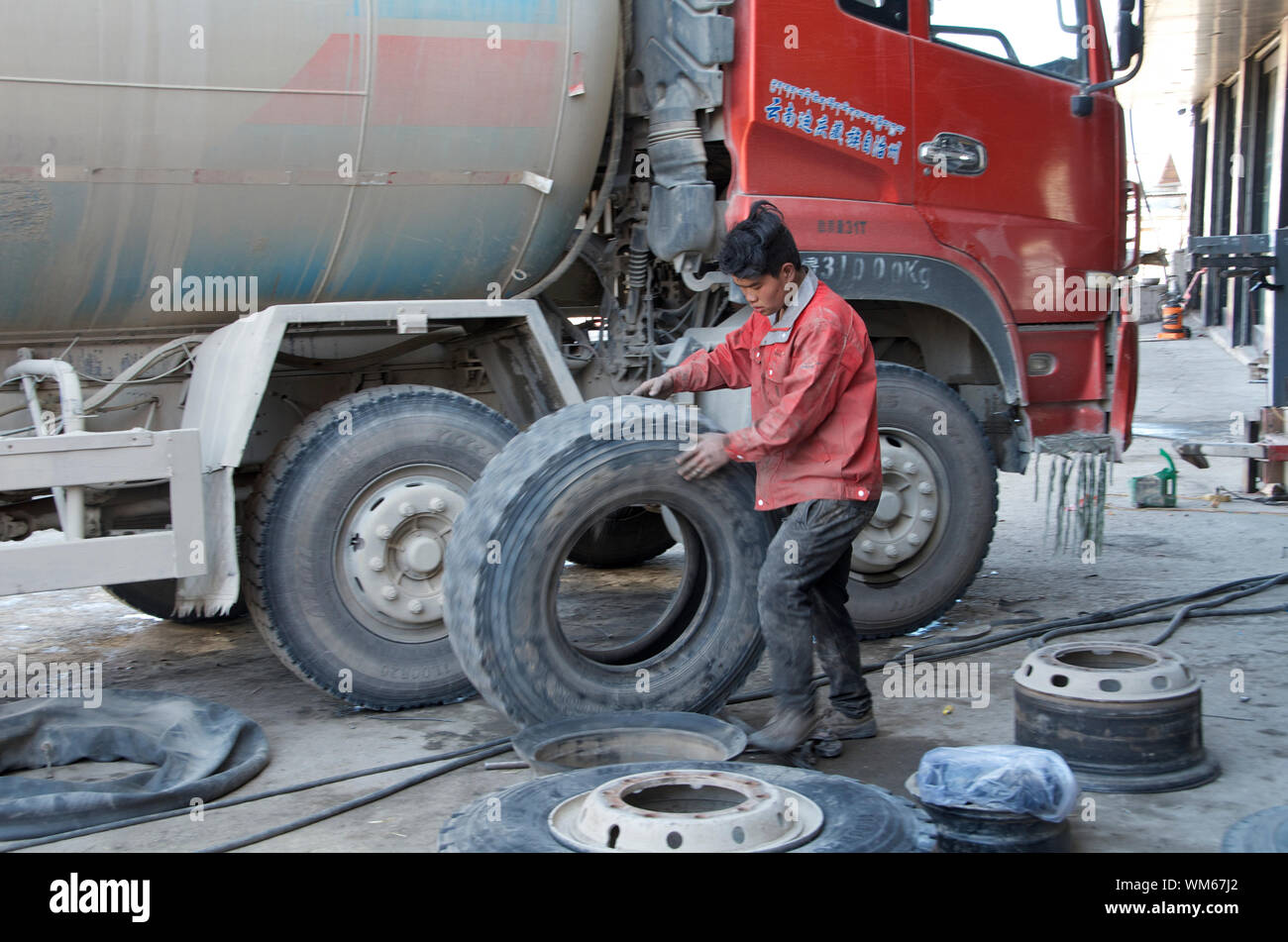 a garage for trucks in a small town of Yunnan in China Stock Photo - Alamy