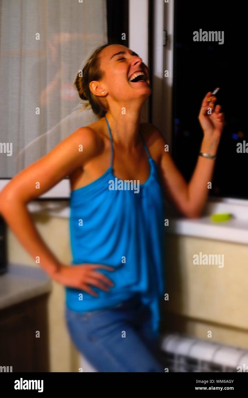 Woman laughing head back hi-res stock photography and images - Alamy
