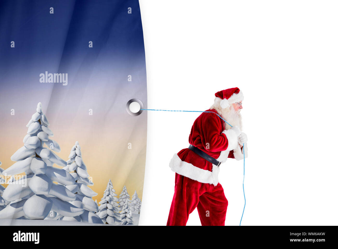 Santa claus pulling rope against white curtain blind Stock Photo - Alamy