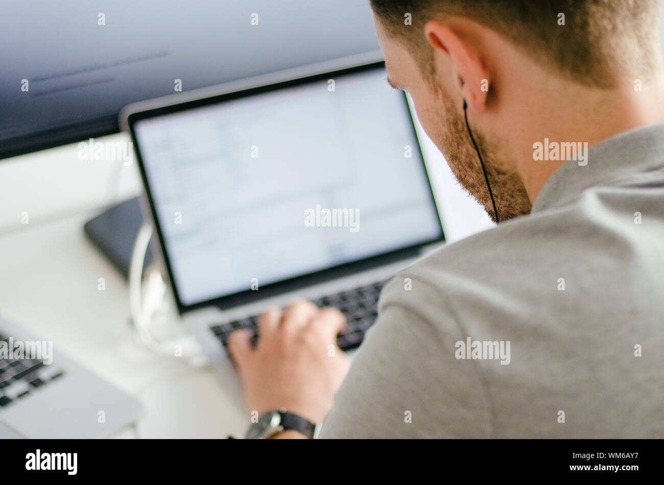 Man laptop rear view hi-res stock photography and images - Alamy