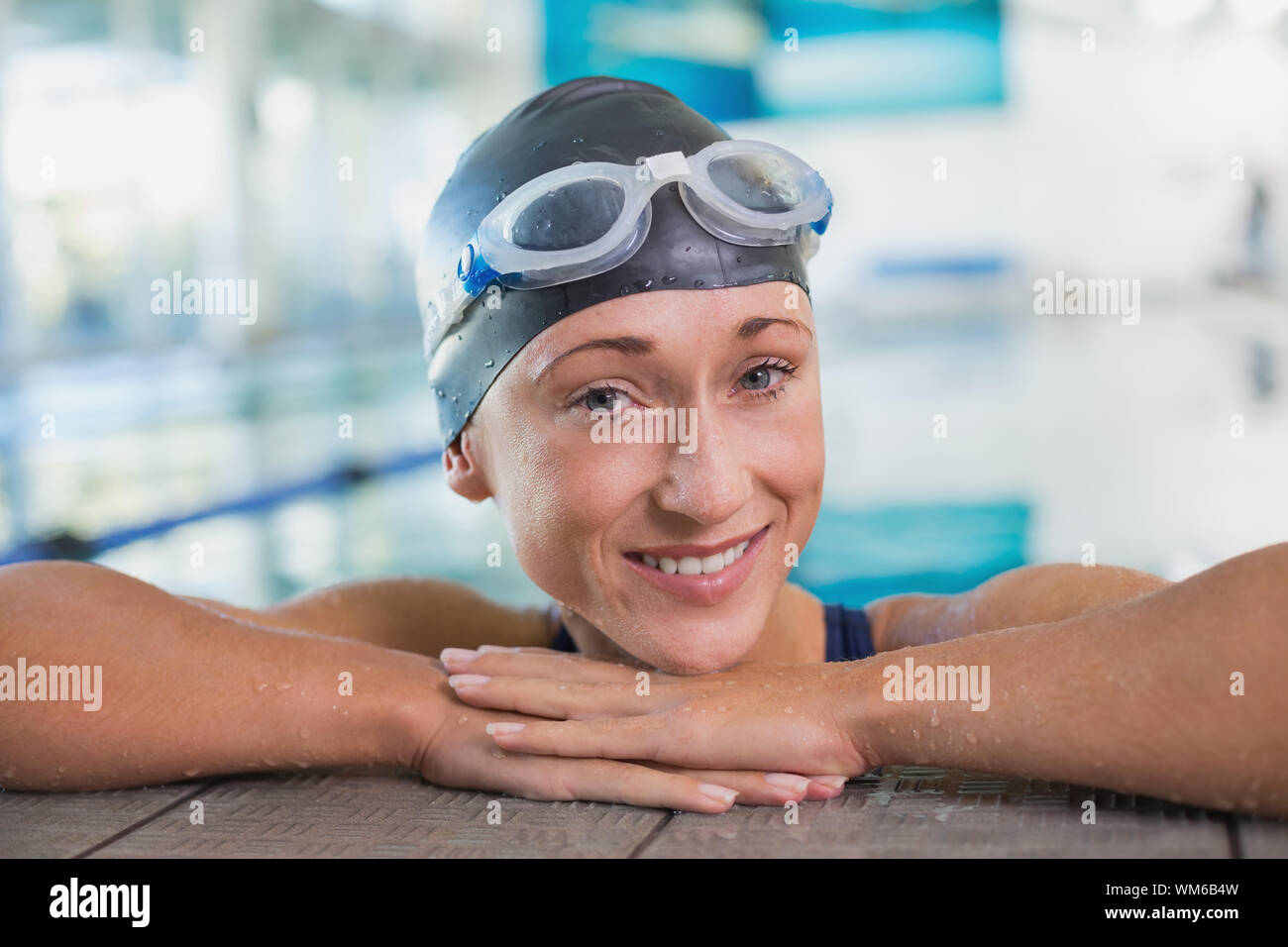 Close up portrait of a fit female swimmer in the pool at leisure center ...