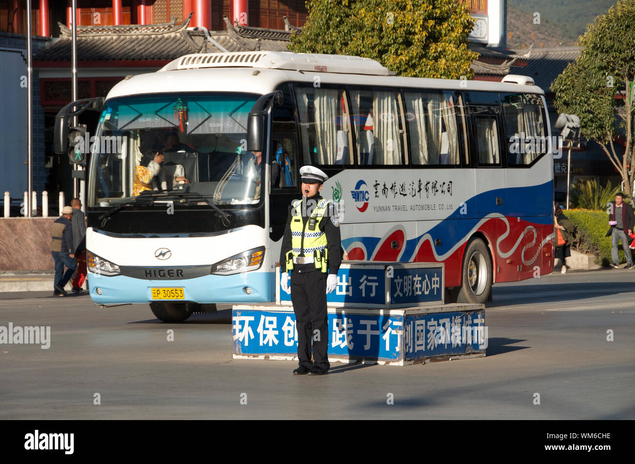 Chinese policeman regulates traffic in Shangri La City, Yunnan Stock ...