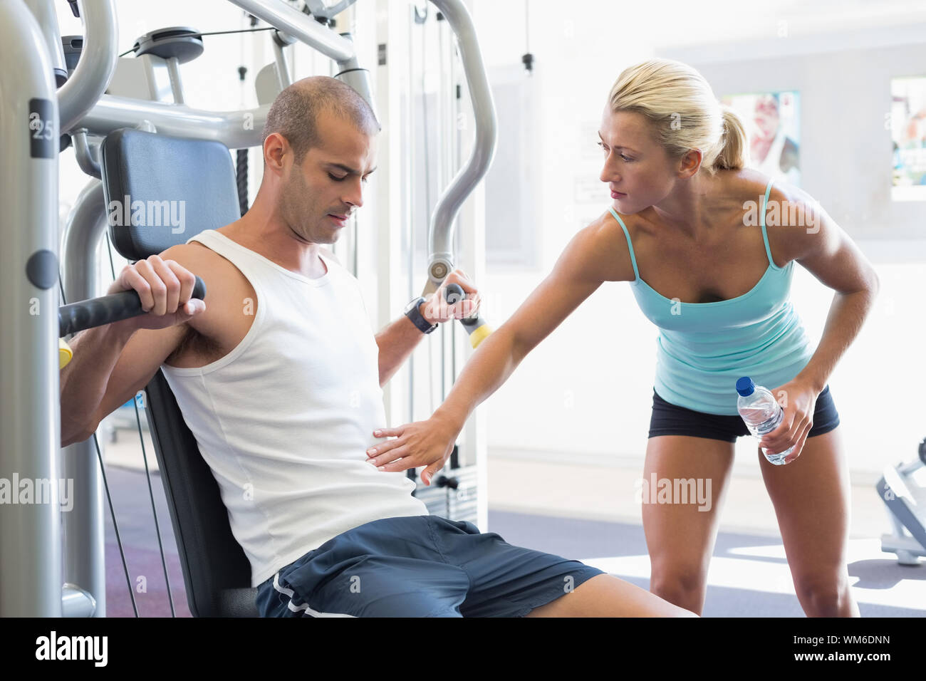 Helping trainer guiding female hi-res stock photography and images - Alamy