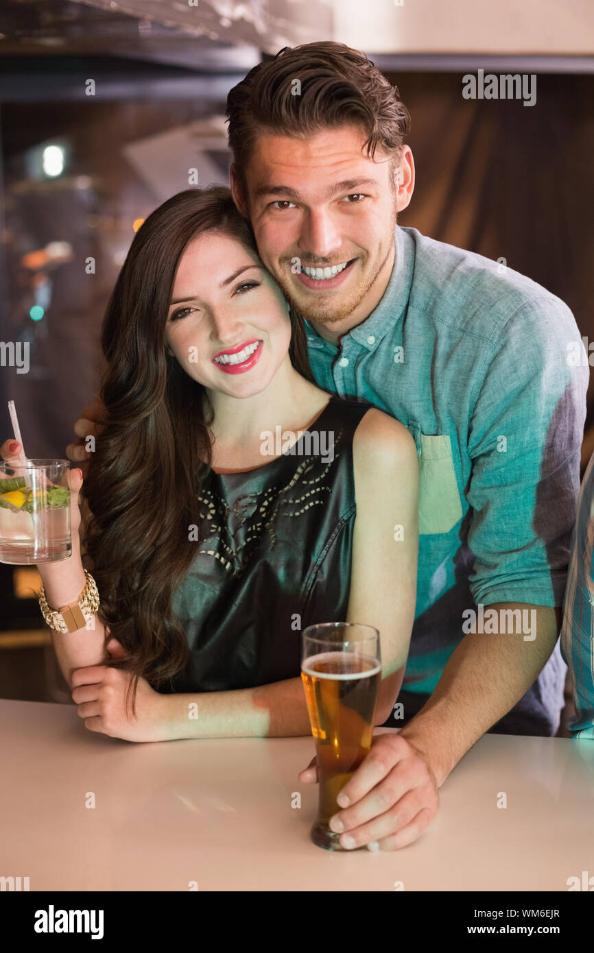 Young couple having a drink together at the bar Stock Photo - Alamy