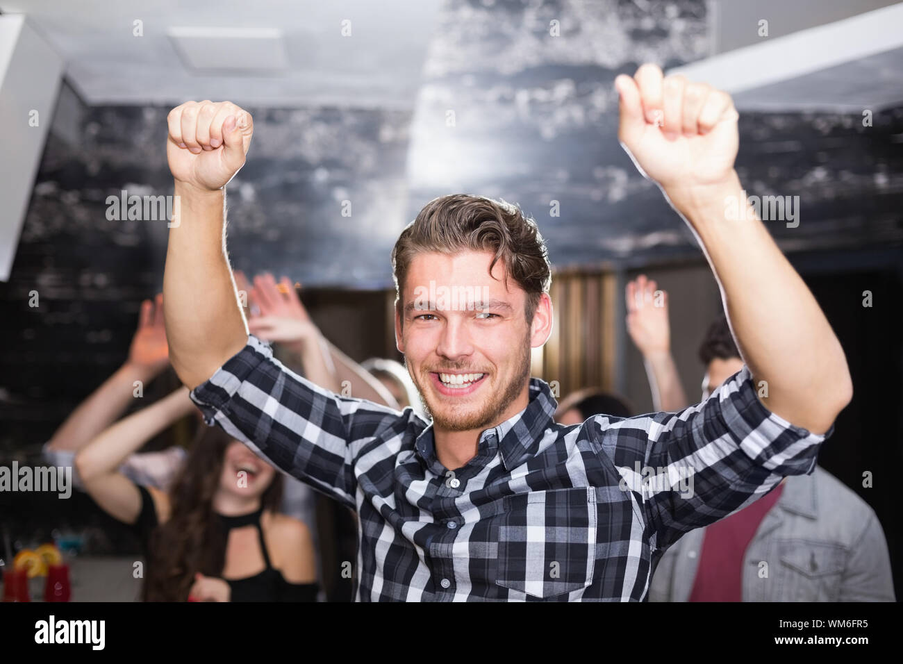 Stylish man smiling and dancing at the bar Stock Photo - Alamy