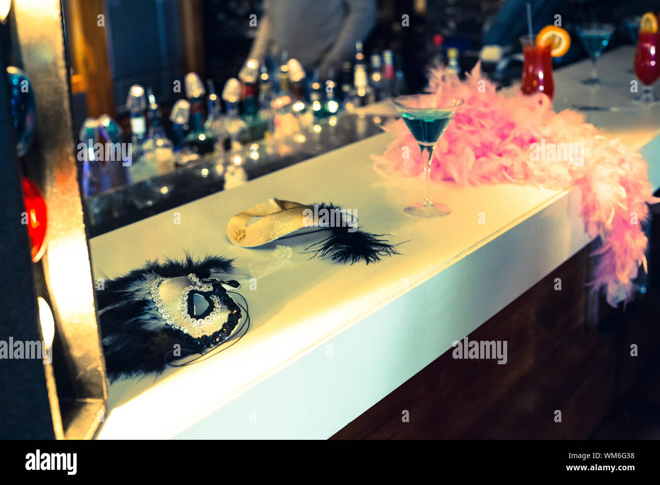 Masquerade masks and cocktails at the bar Stock Photo - Alamy