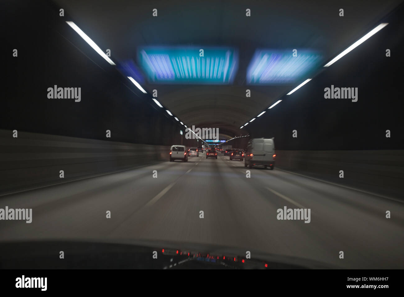 Man driving through a tunnel at night time Stock Photo - Alamy