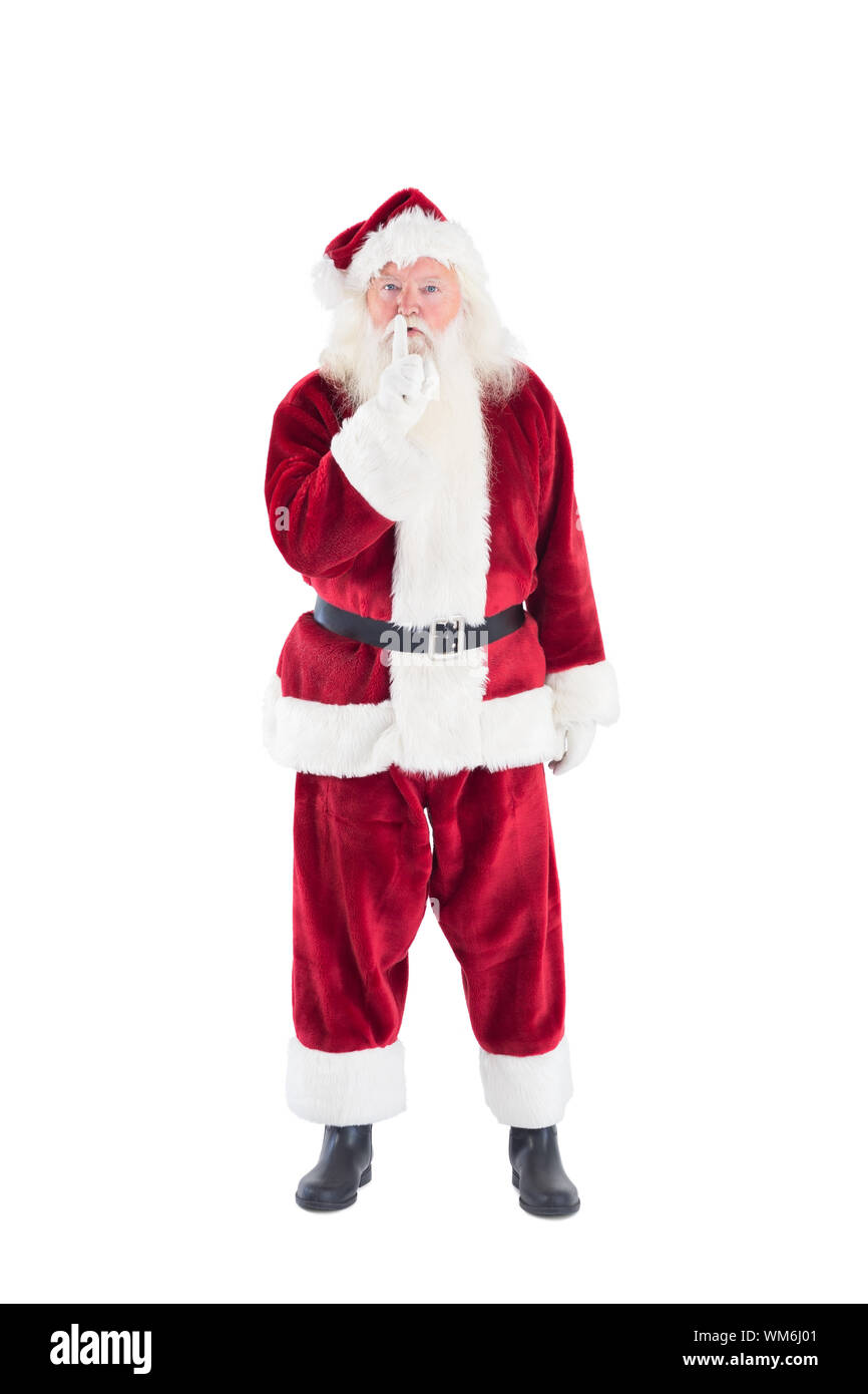 Santa asking for quiet to camera on white background Stock Photo - Alamy