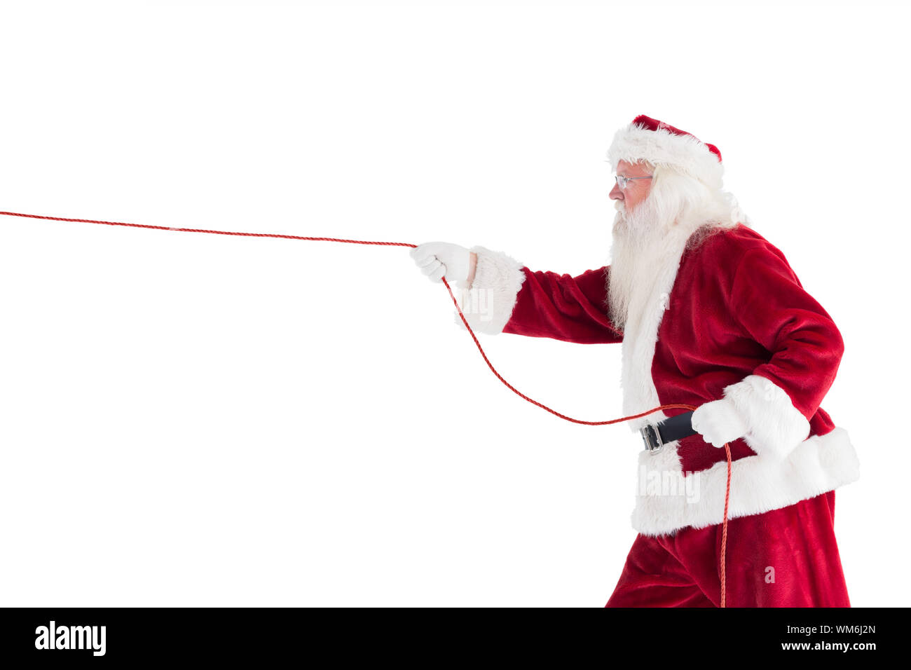 Santa pulls something with a rope on white background Stock Photo - Alamy