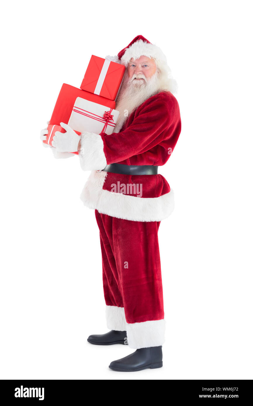 Santa carries a few presents on white background Stock Photo - Alamy
