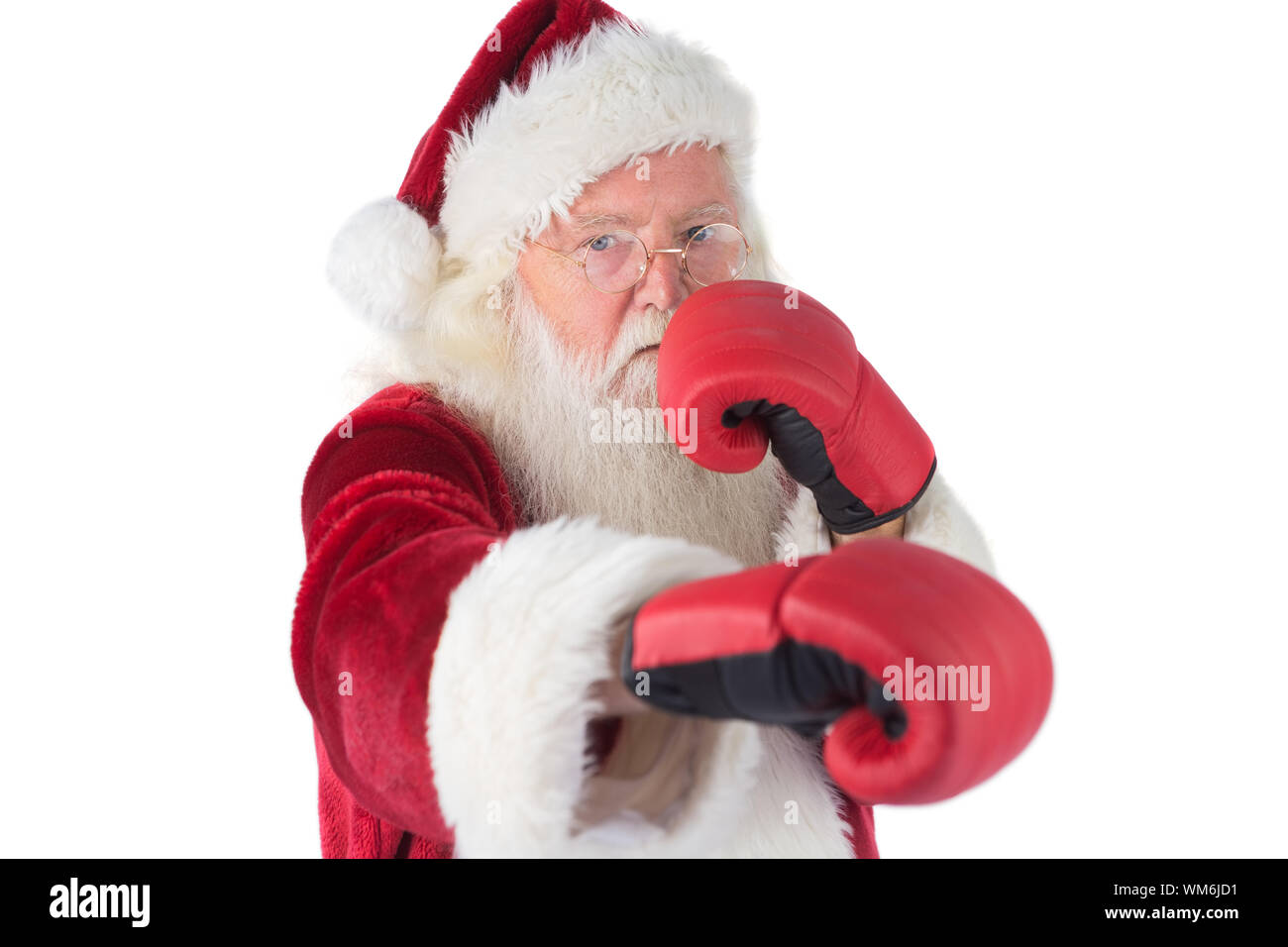 Santa Claus punches with his right on white background Stock Photo - Alamy